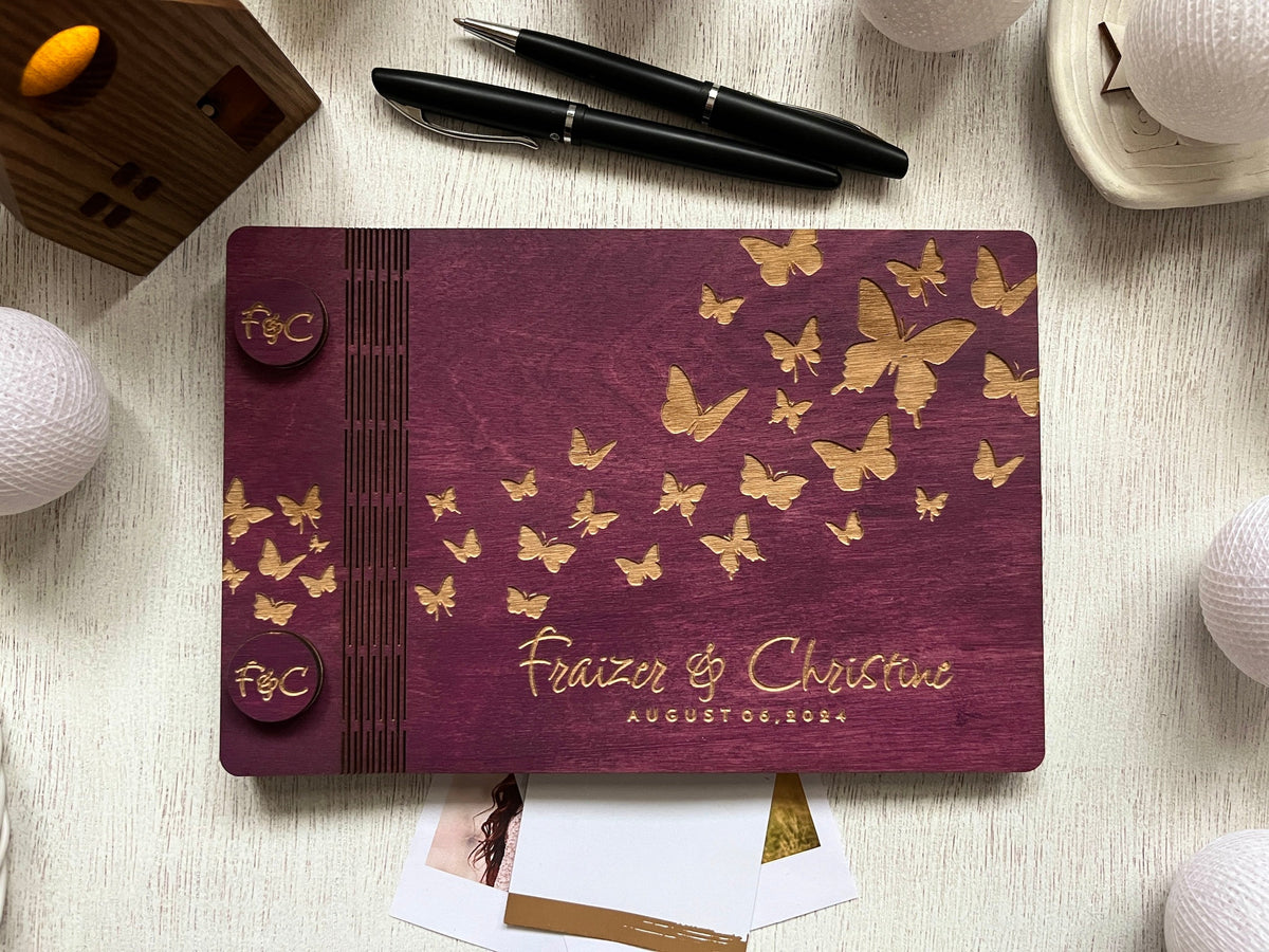 Classic personalized wedding guest book with engraved butterflies and ...